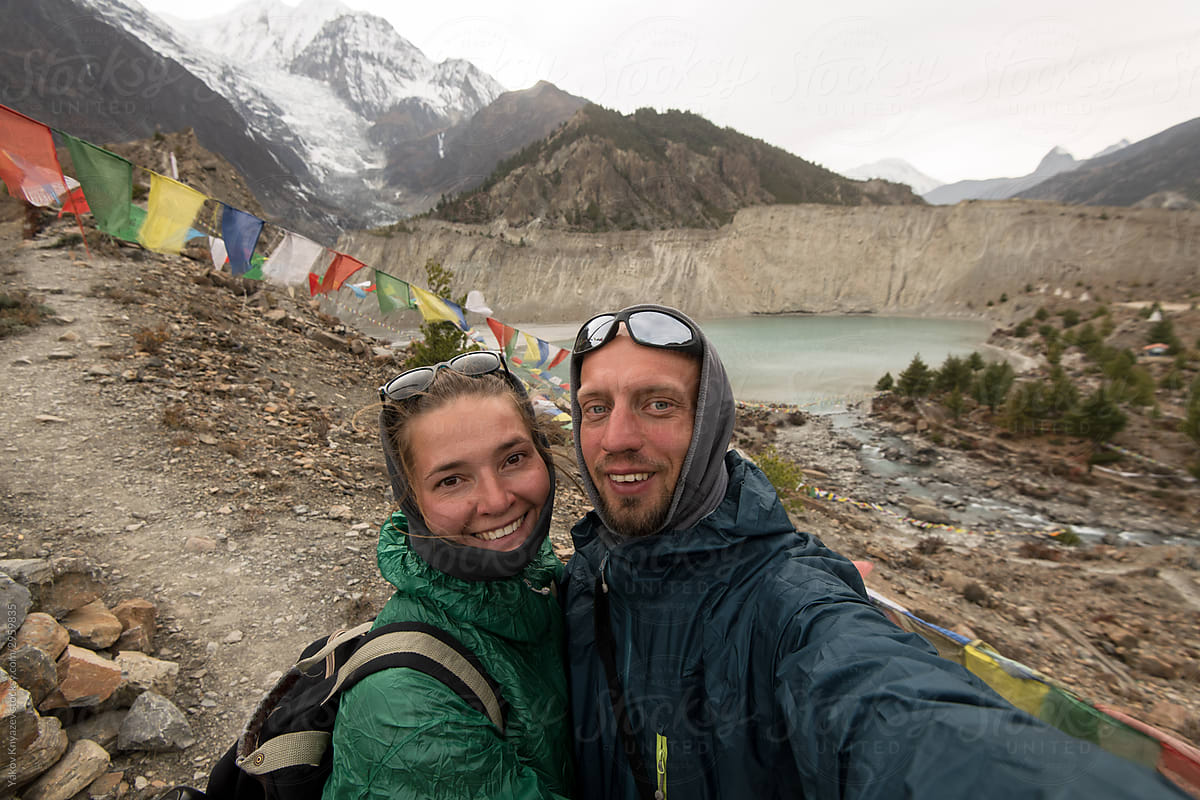 Selfie of a young couple high in mountains - Stock Image - Everypixel