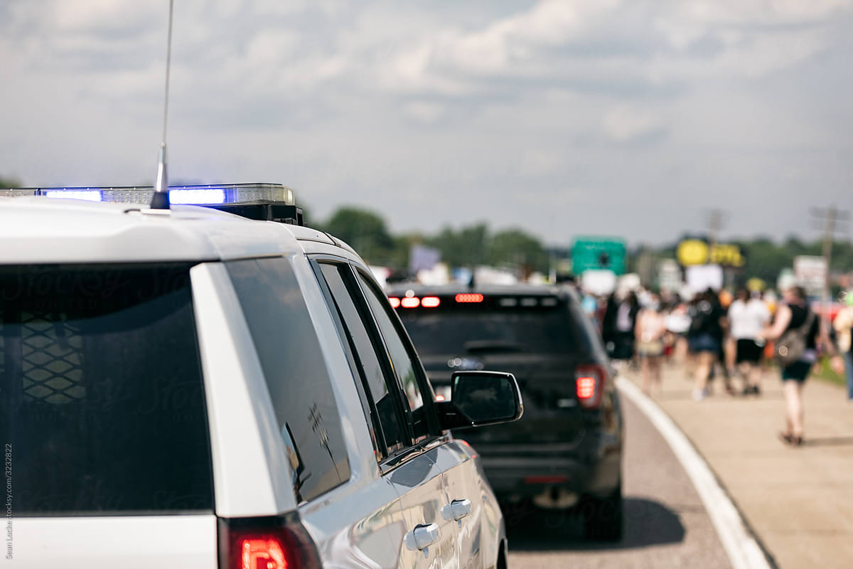 "BLM: Police Vehicles Escort Peaceful Protestors On Highway" by Stocksy ...