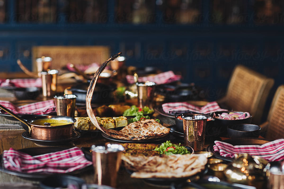 Traditional Indian Food On Dinner Table Del Colaborador De Stocksy Traditional Indian Food On Dinner Table Del Colaborador De Stocksy
