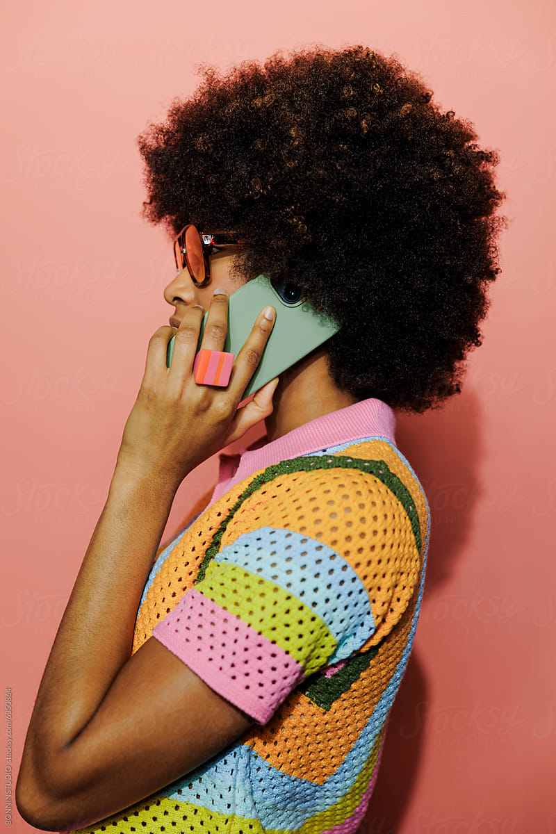"Woman With Afro Hairstyle Talking On Phone" by Stocksy Contributor ...