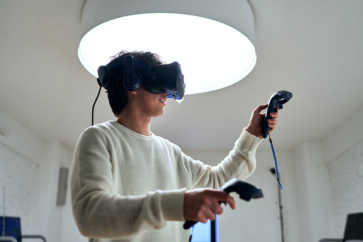 "Man Using VR" by Stocksy Contributor "MEM Studio" - Stocksy