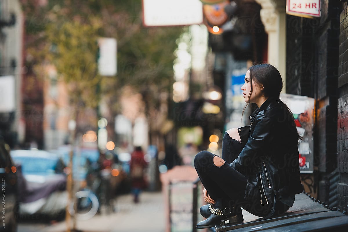 "Young Woman Sitting Alone Outside In The City" by Stocksy Contributor ...