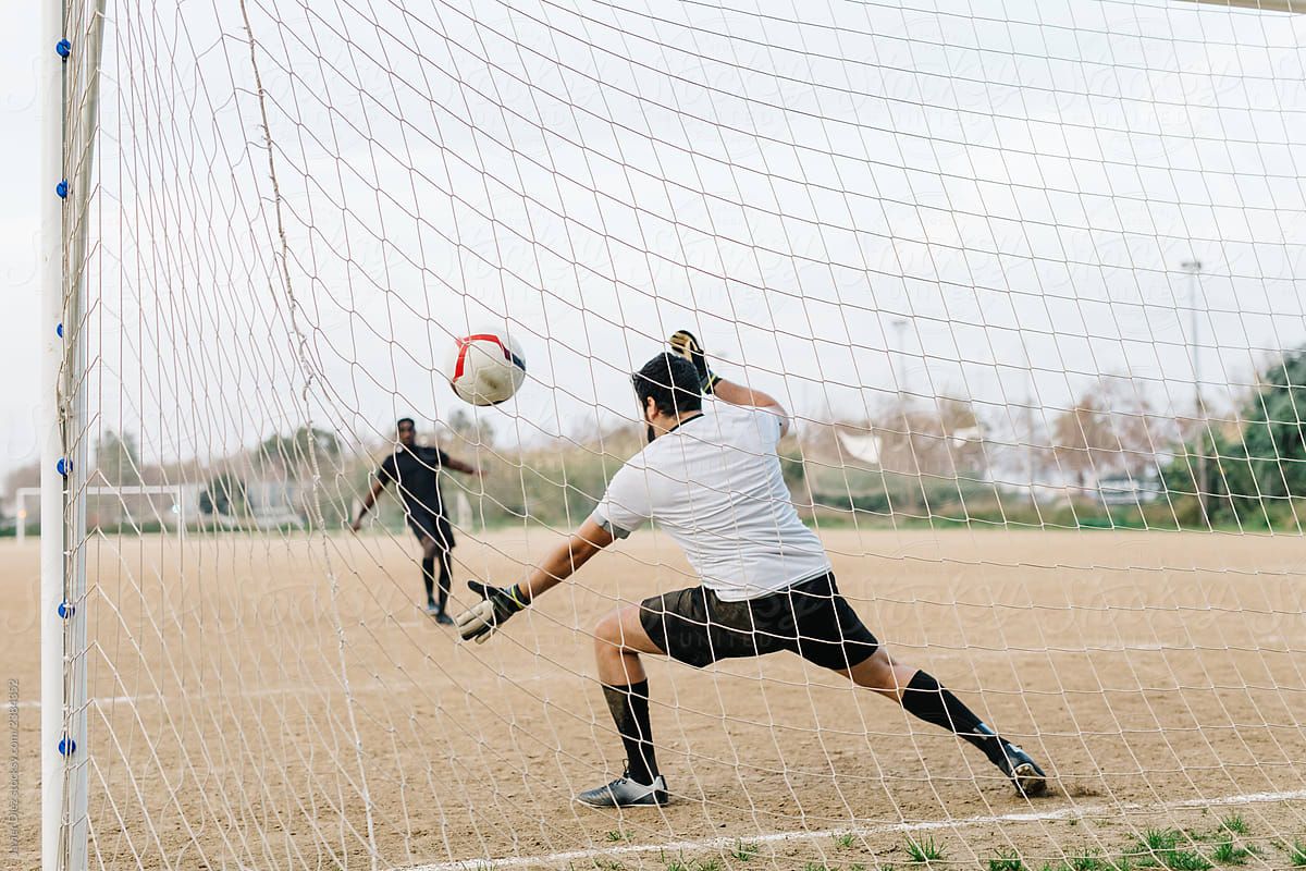 "Man Trying To Catch Ball Near Goal Post" by Stocksy Contributor ...