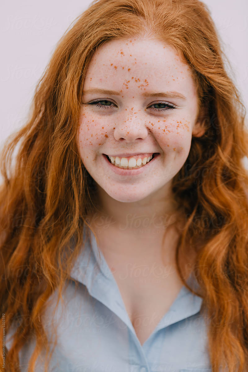 A Smiling Scottish Teenager With Ginger Hair And Freckles By Stocksy