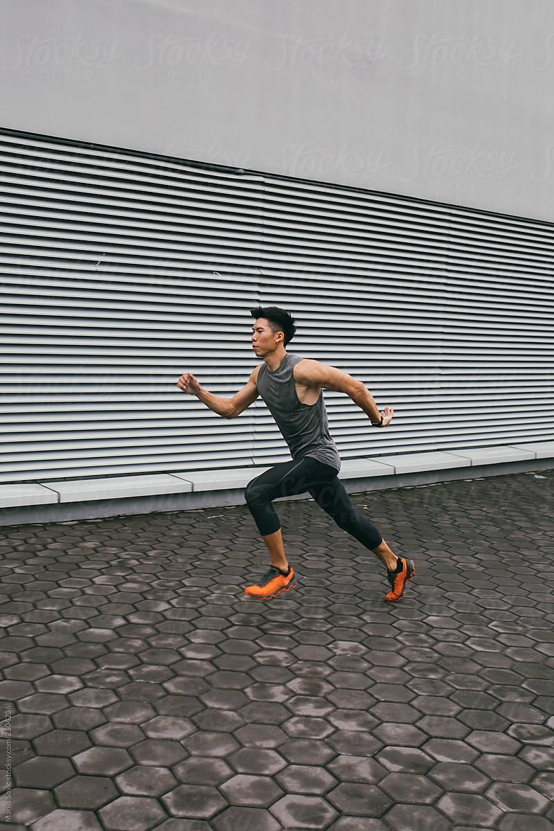 "Asian Man Running With Motion Blur" by Stocksy Contributor "Maia ...