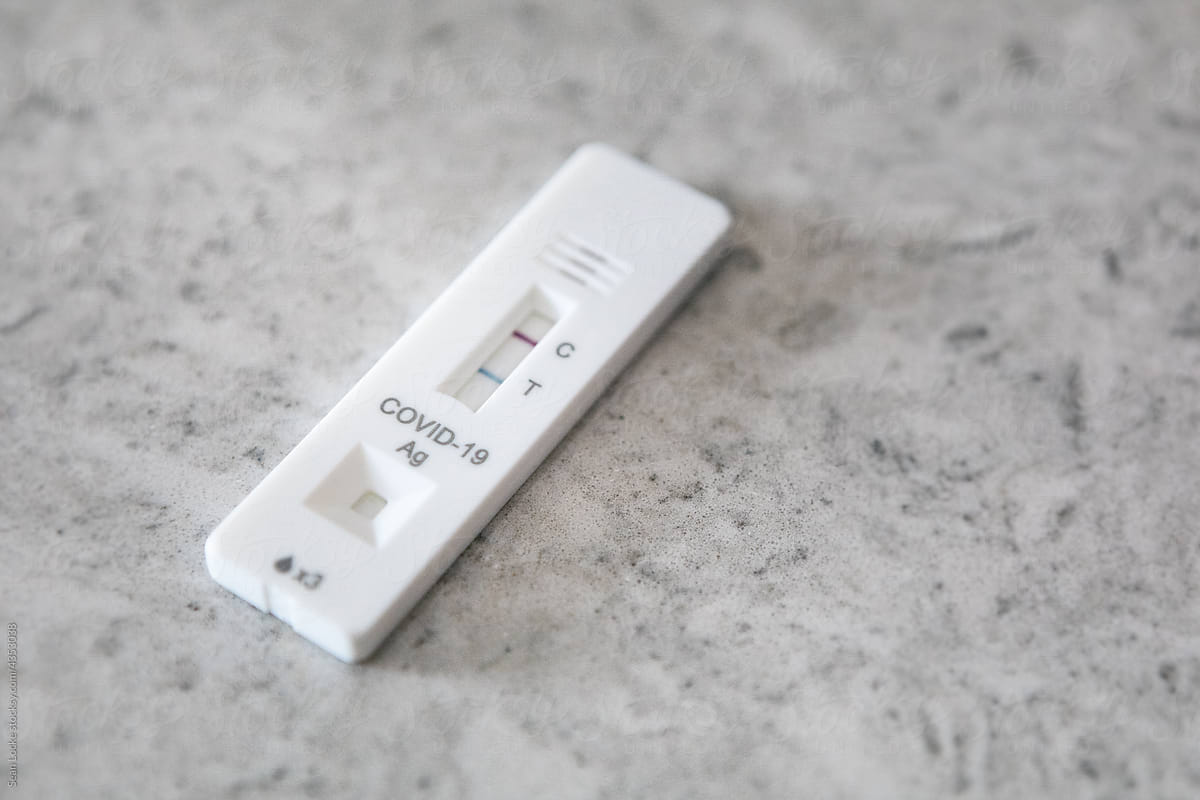 "At Home Positive Covid Test On Counter" by Stocksy Contributor "Sean ...