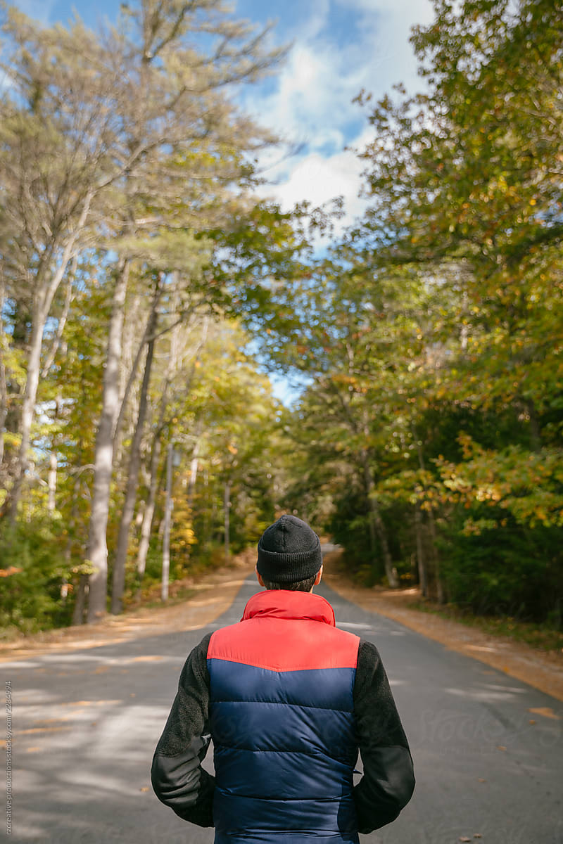 "Man Staring Down Roadway With His Back To Camera." by Stocksy ...