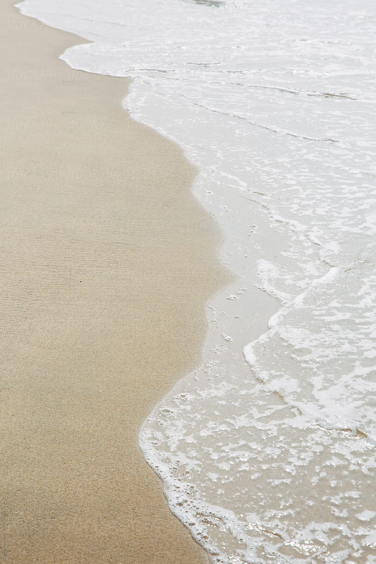 "Ocean Wave Rolling Over Sand" by Stocksy Contributor "Curtis Kim ...