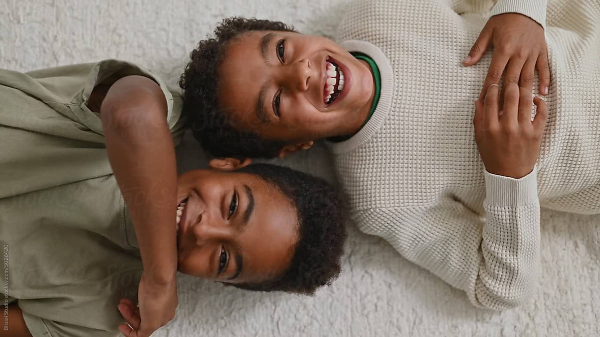 "Black Brothers Lying On Floor Together" by Stocksy Contributor "Bisual ...