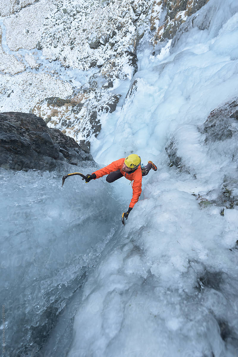 "Man Climbing Frozen Waterfall" by Stocksy Contributor "Ibex.media ...