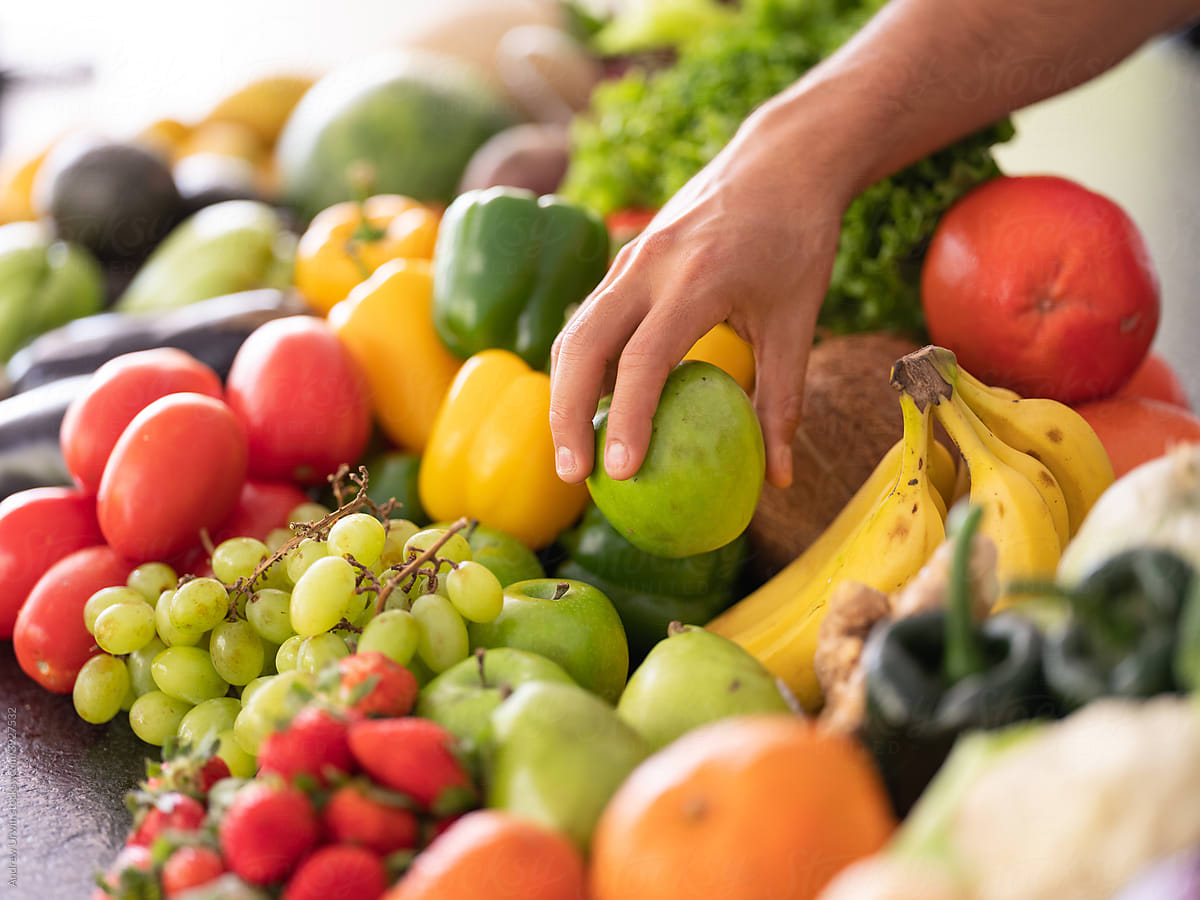 "A Grouped Collection Of Different Fruits And Vegetables. A Hand ...