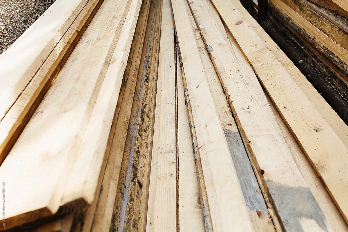 "Pile Of Wooden Boards" by Stocksy Contributor "Laura Stolfi" - Stocksy