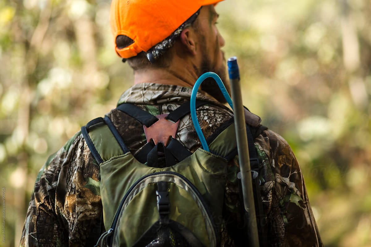 "Deer Hunter From Behind" by Stocksy Contributor "Reece McMillan" - Stocksy