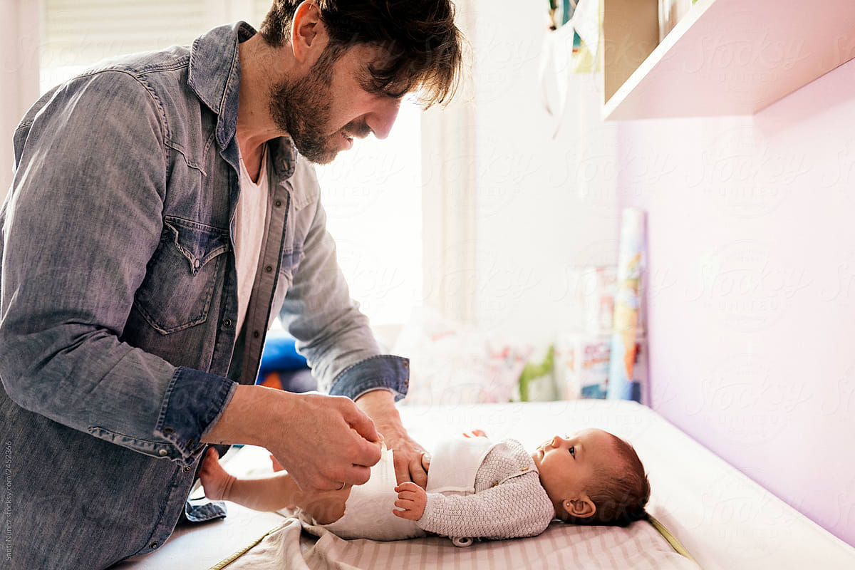 "Father And His Baby Having Fun At Home" by Stocksy Contributor "Santi ...