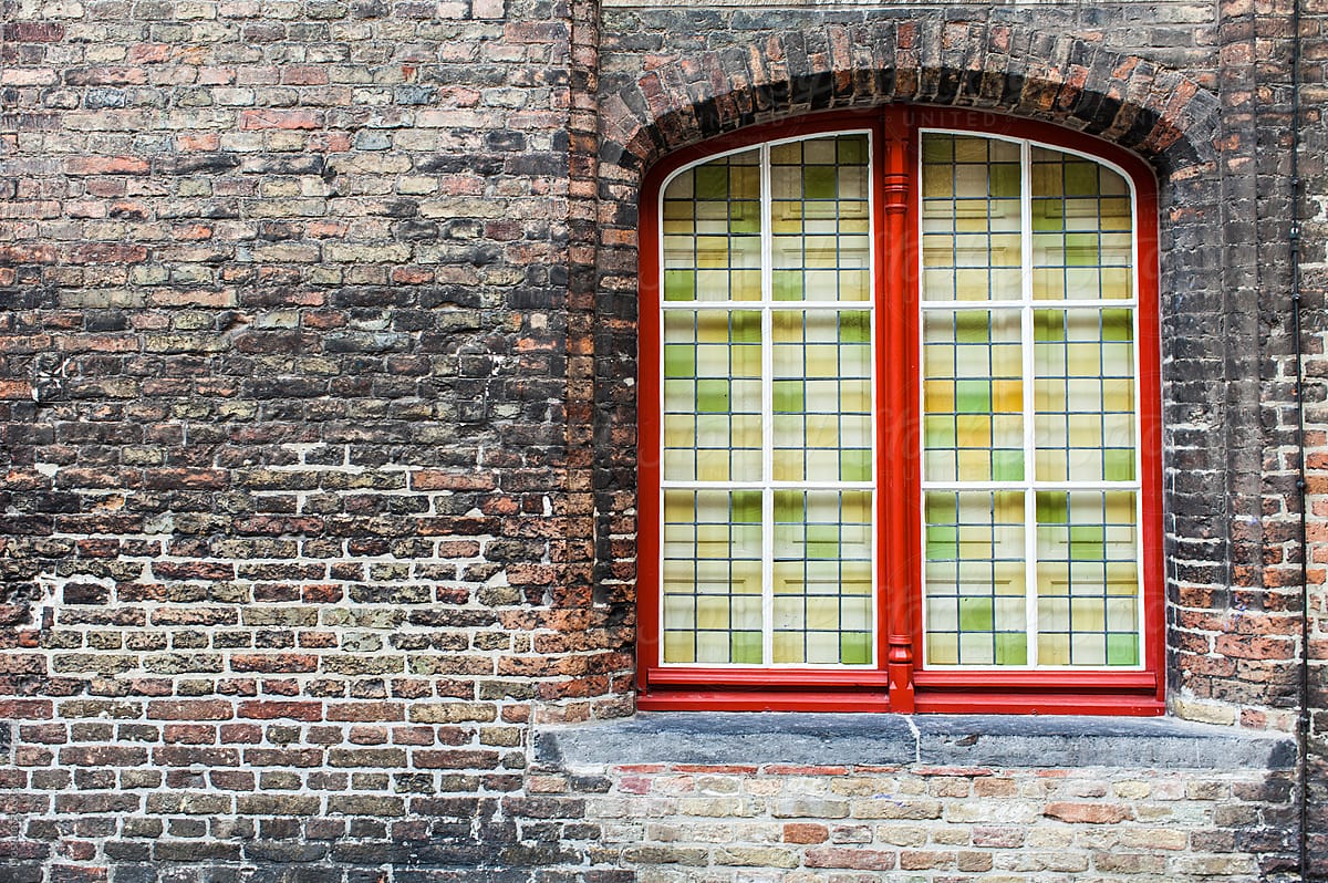 "Colourful Window On A Brick Building" by Stocksy Contributor "Mosuno ...