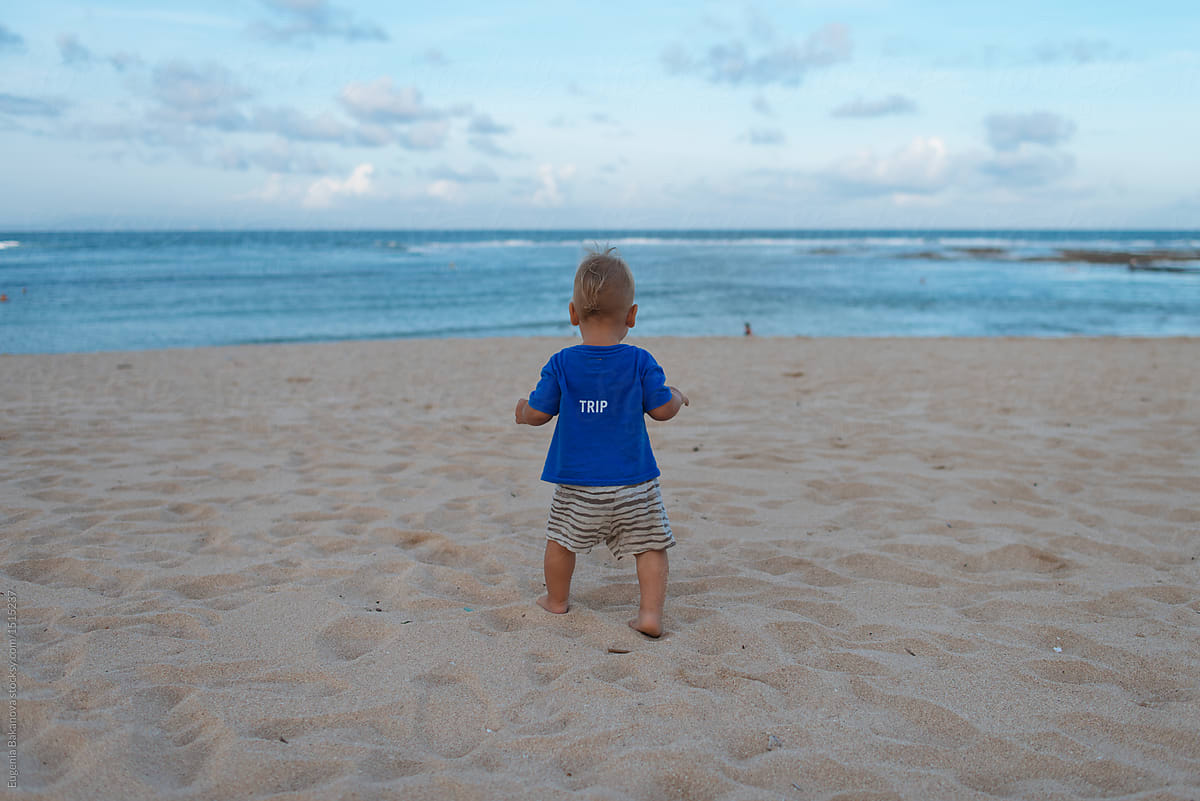 "Child Walking On Tropical Beach" by Stocksy Contributor "Alexander ...