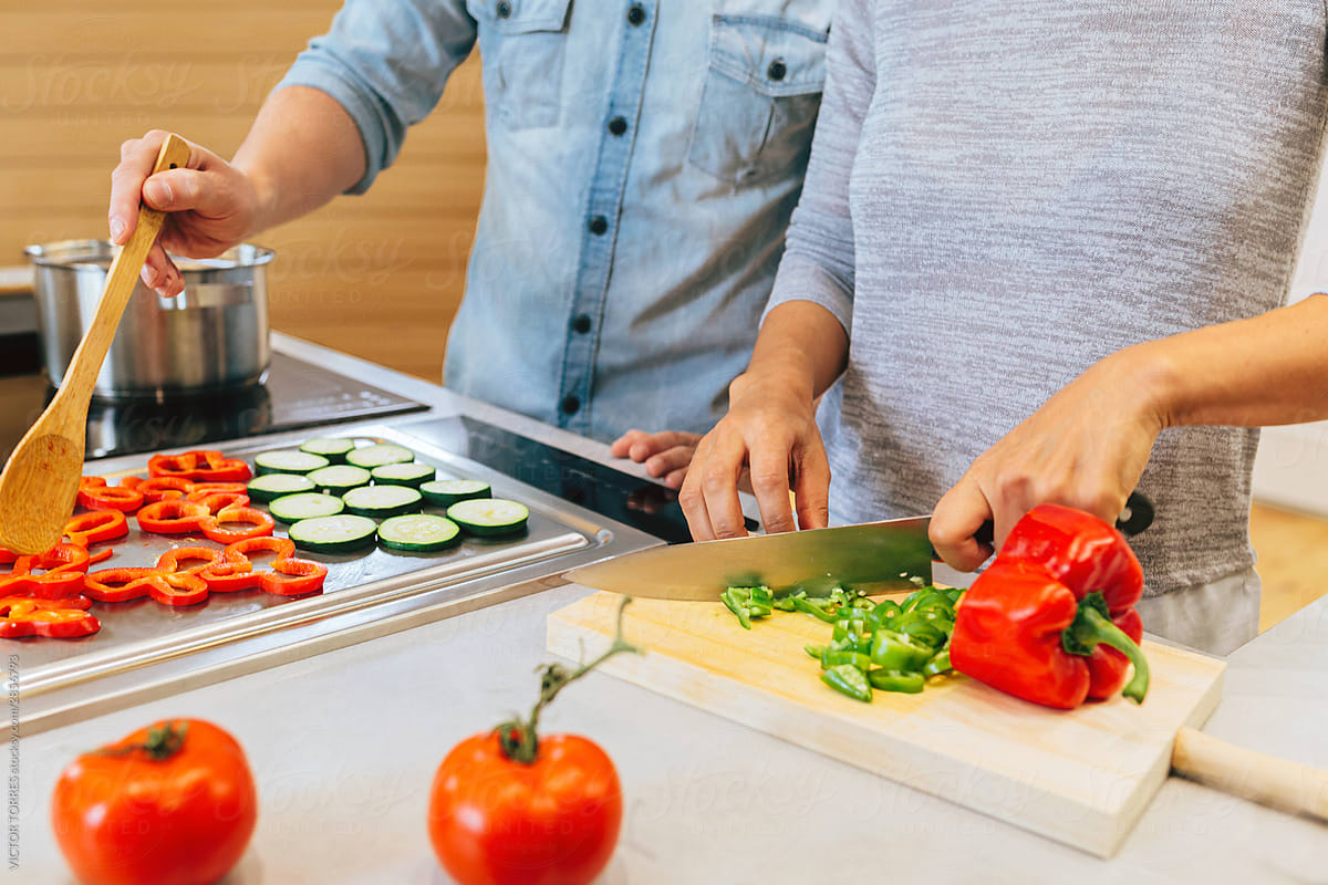 "Couple Cooking In The Kitchen" by Stocksy Contributor "VICTOR TORRES ...