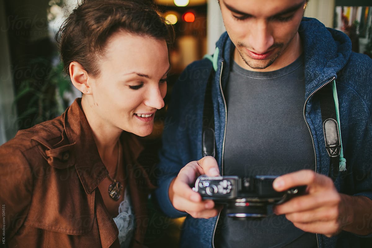 "Young Couple Is Using Camera" by Stocksy Contributor "Mattia" - Stocksy