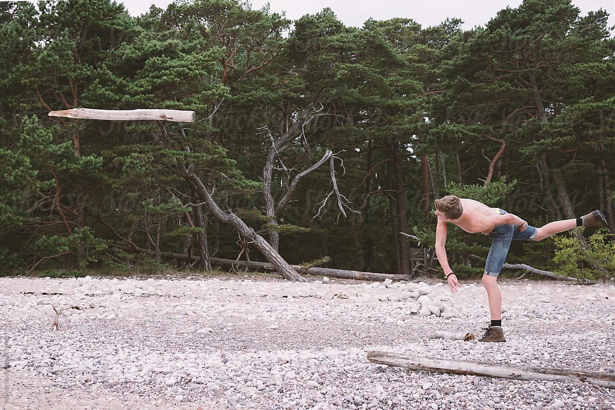 "Trunk Throwing On The Beach" by Stocksy Contributor "Marcel" - Stocksy