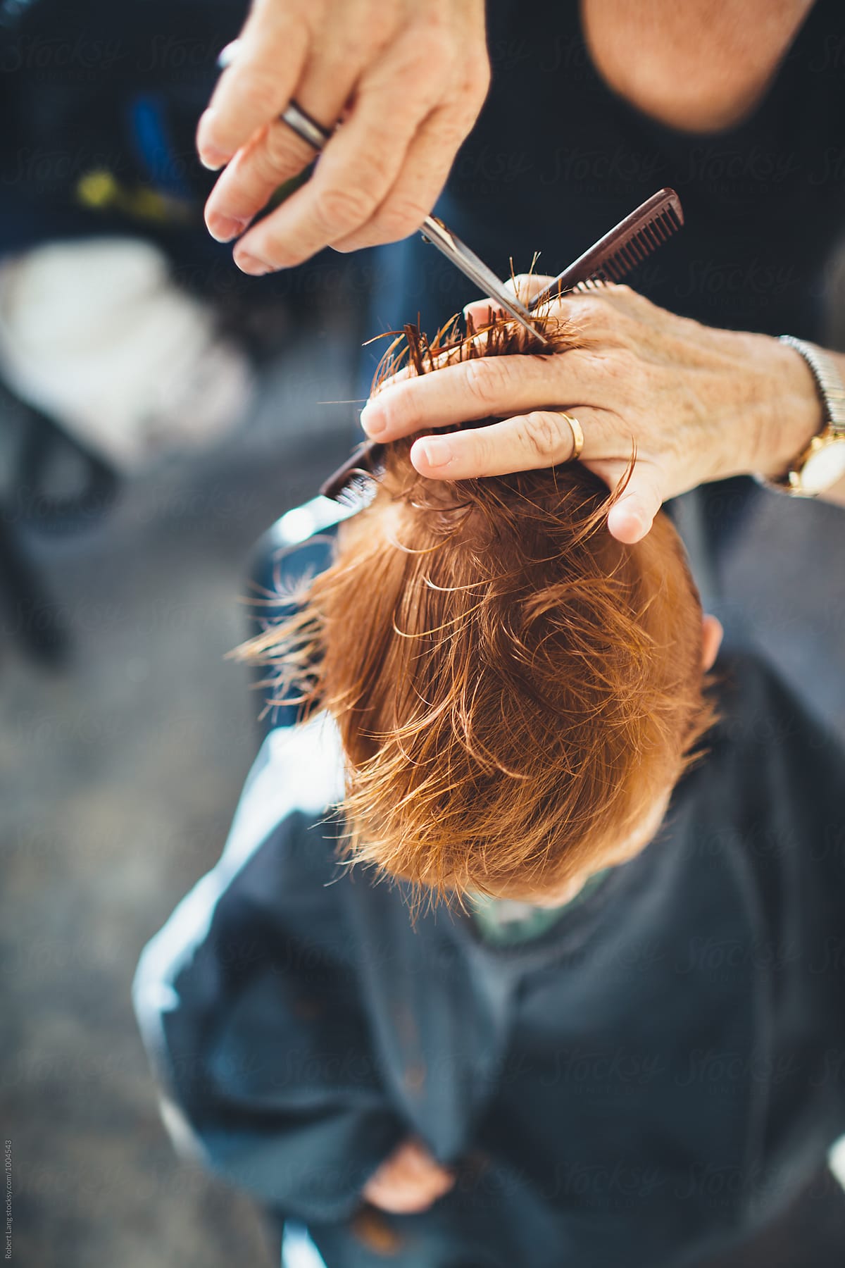 "Getting A Haircut At Home" by Stocksy Contributor "Robert Lang" - Stocksy