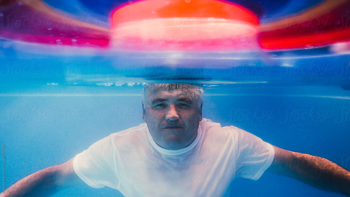 "Man Underwater In A Swimming Pool" by Stocksy Contributor "Robert Lang ...
