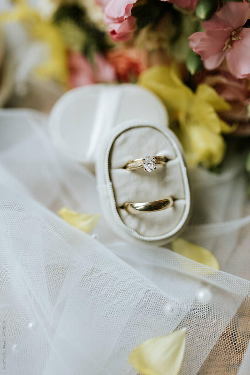 "Wedding Rings In Ring Box With Bright Floral Background On Bridal Veil ...