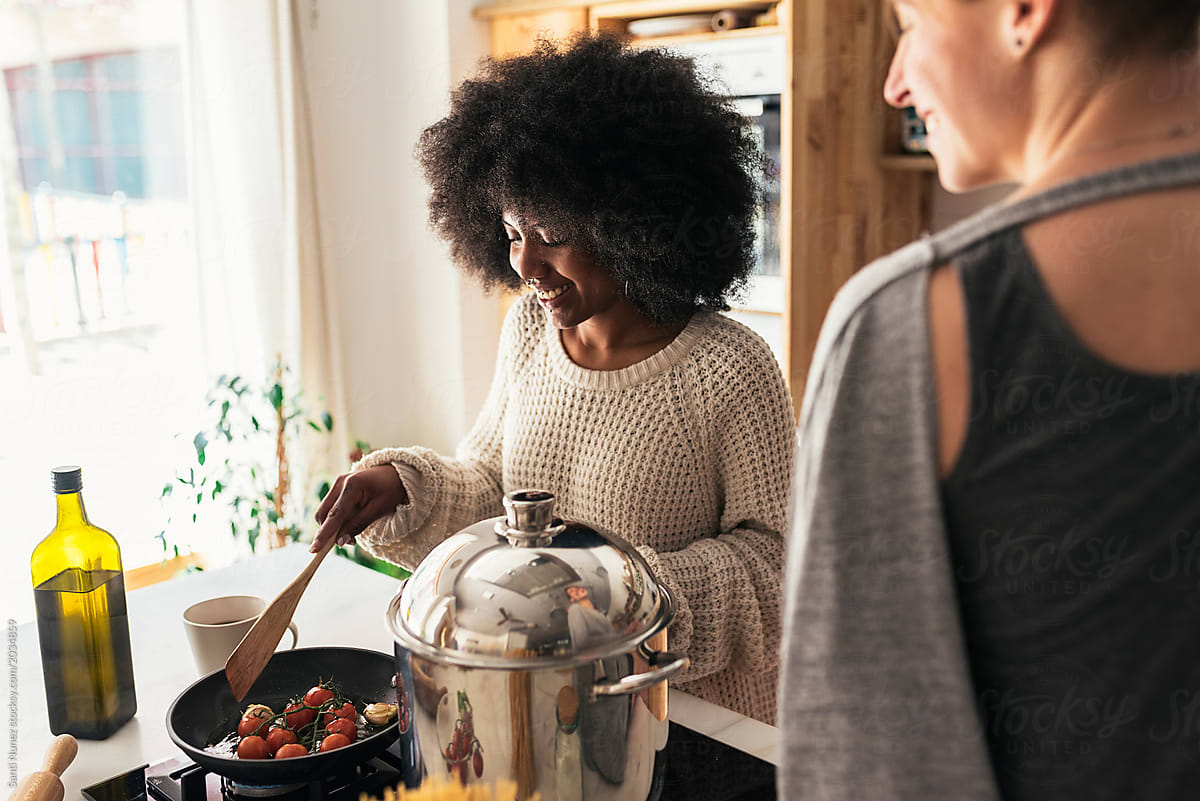 "Two Beautiful Girls Cooking In Them Home." by Stocksy Contributor ...