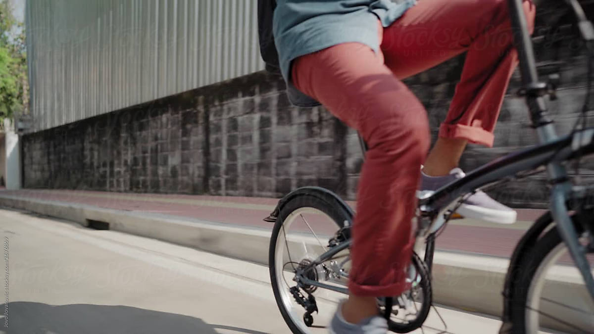 "Man Riding Folding Bicycle To Work" by Stocksy Contributor "Jovo ...