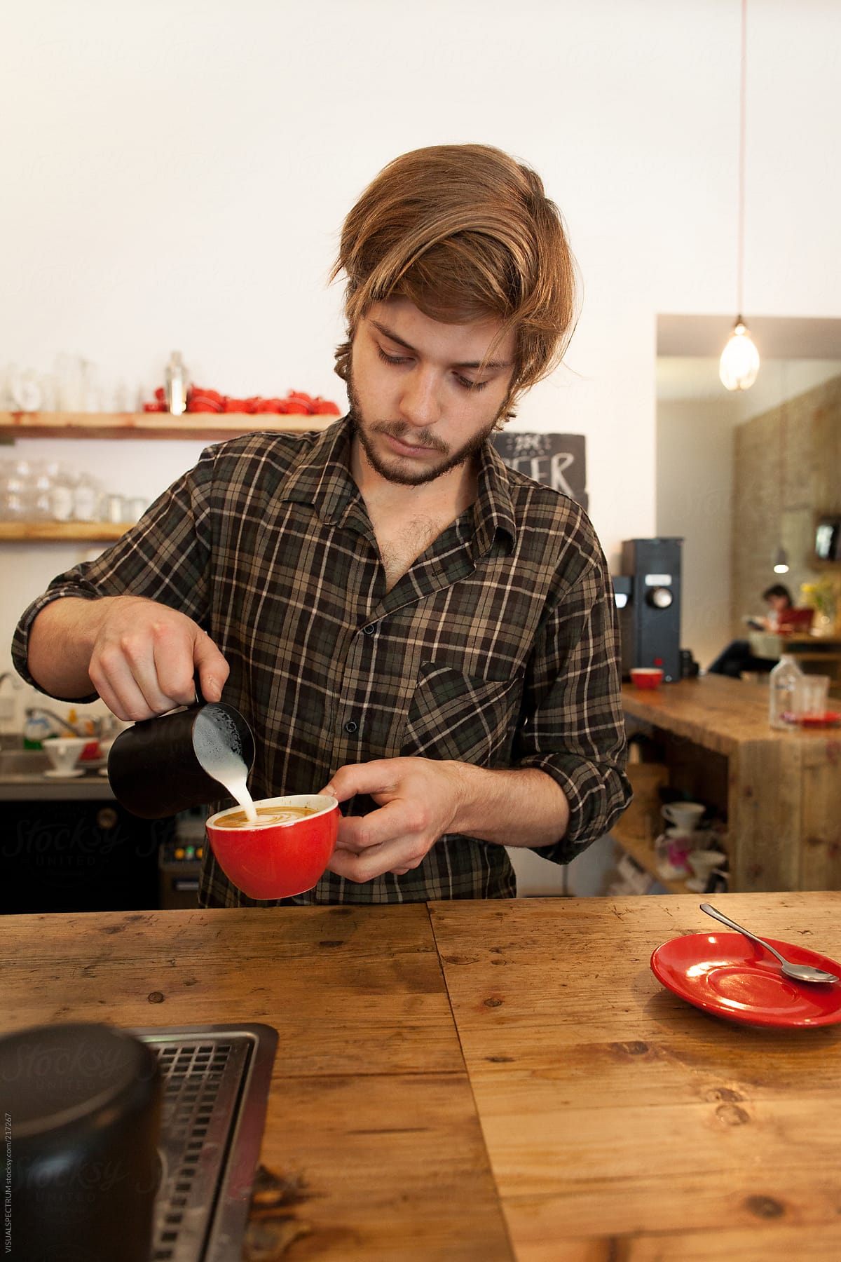 "Male Barista Making Cafe Latte" by Stocksy Contributor "VISUALSPECTRUM ...