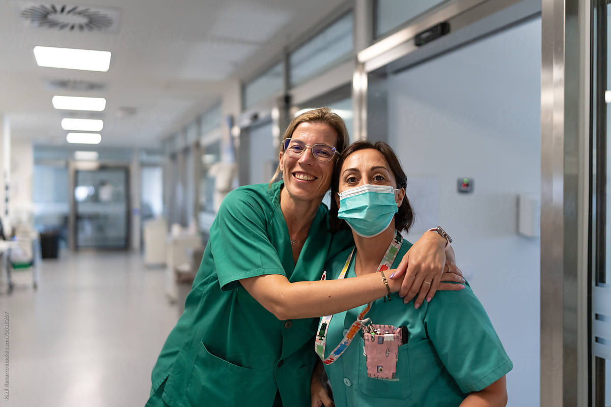 "Two Nurses Hugging And Smiling" by Stocksy Contributor "Raul Navarro ...
