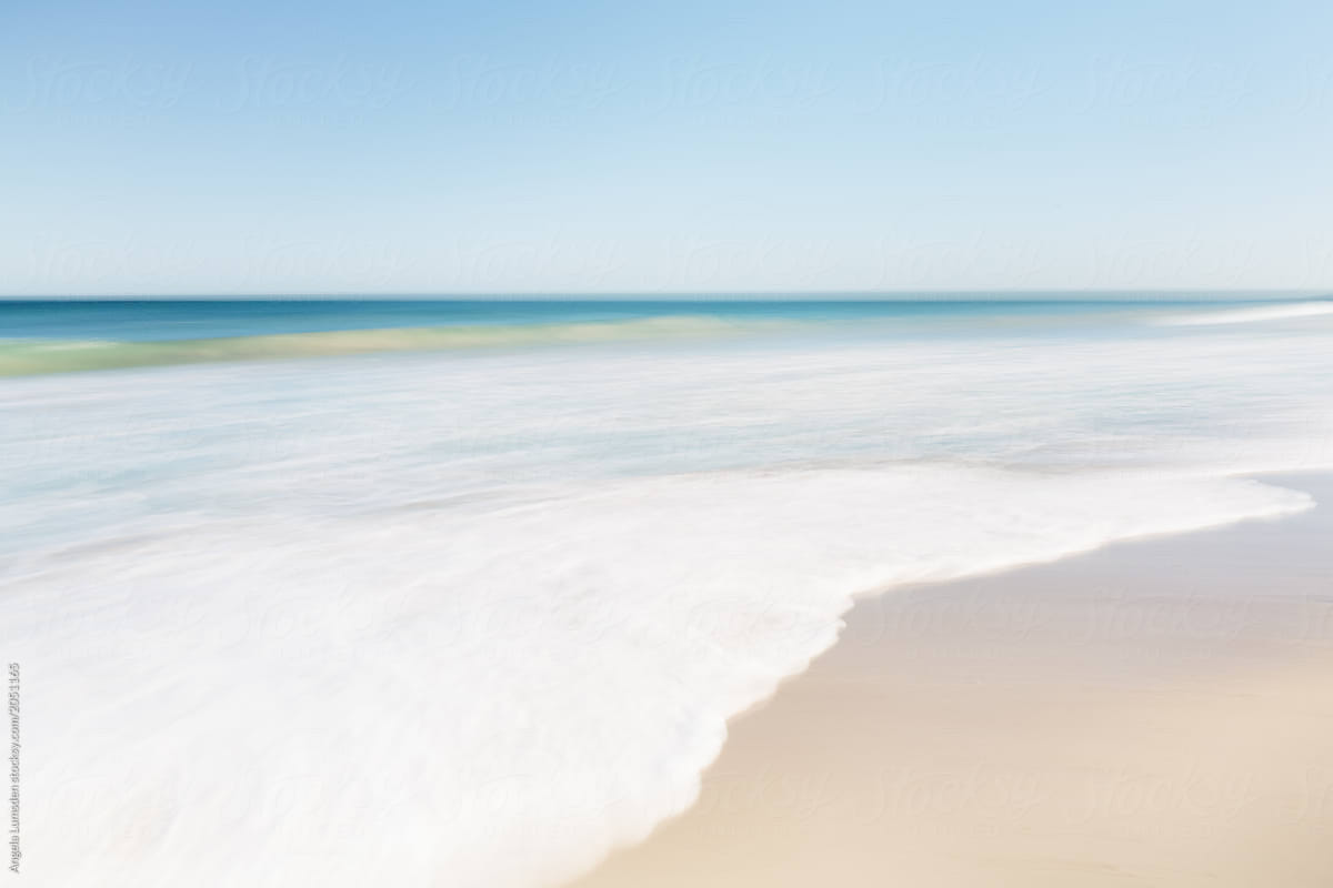 "Abstract Blurred Beach Scene With A Low Wave Breaking" by Stocksy ...