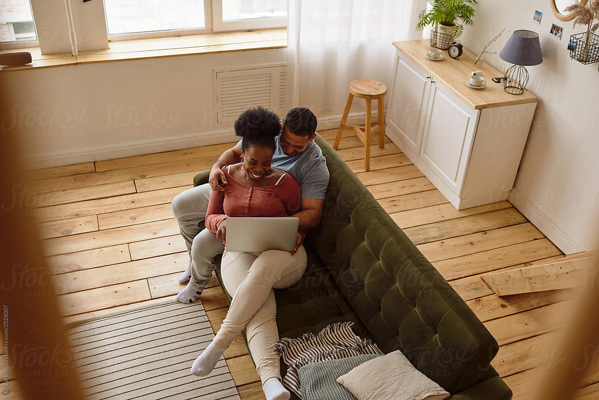 "Married Couple Watching Something On Laptop" by Stocksy Contributor ...