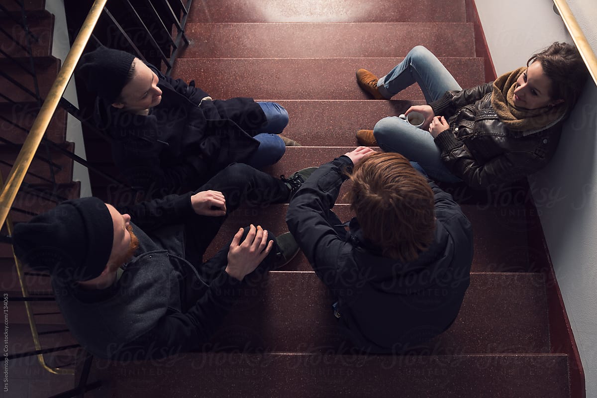 "Friends On Stairway" by Stocksy Contributor "Urs Siedentop & Co" - Stocksy