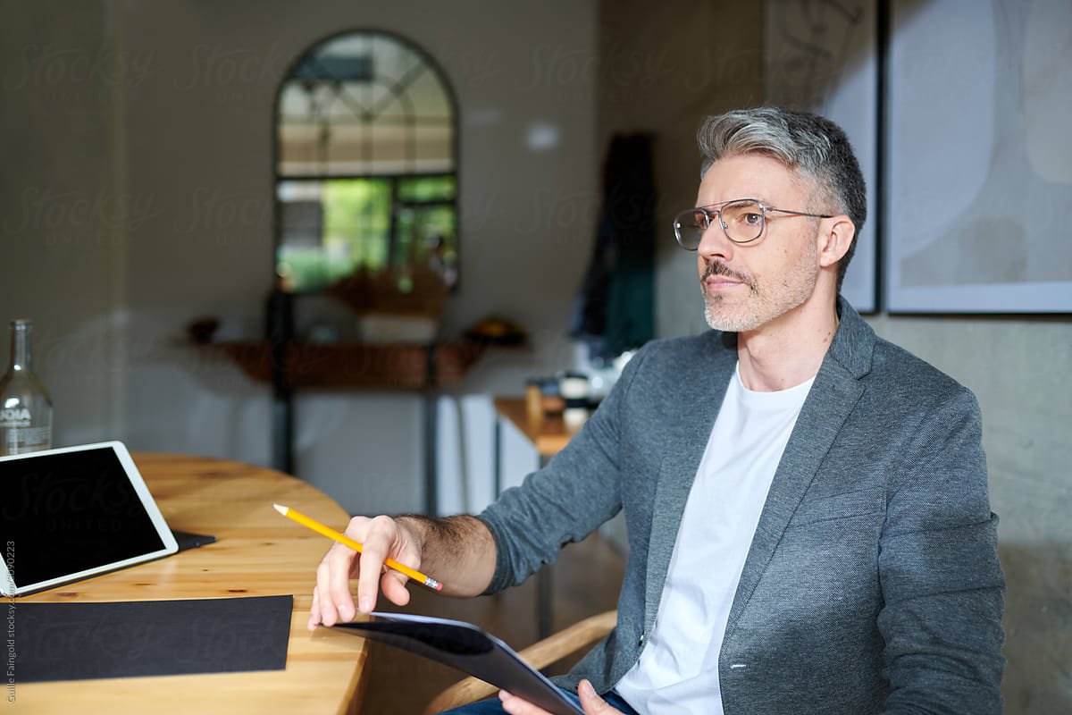 "Businessman Portrait" by Stocksy Contributor "Guille Faingold" - Stocksy