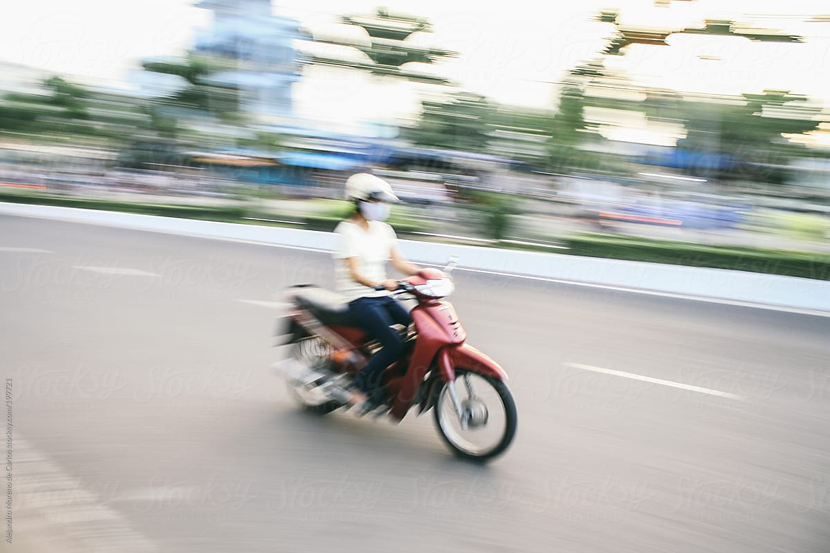 "Young Woman Riding A Motorbike - Moped. Speed Blurred Image" by ...