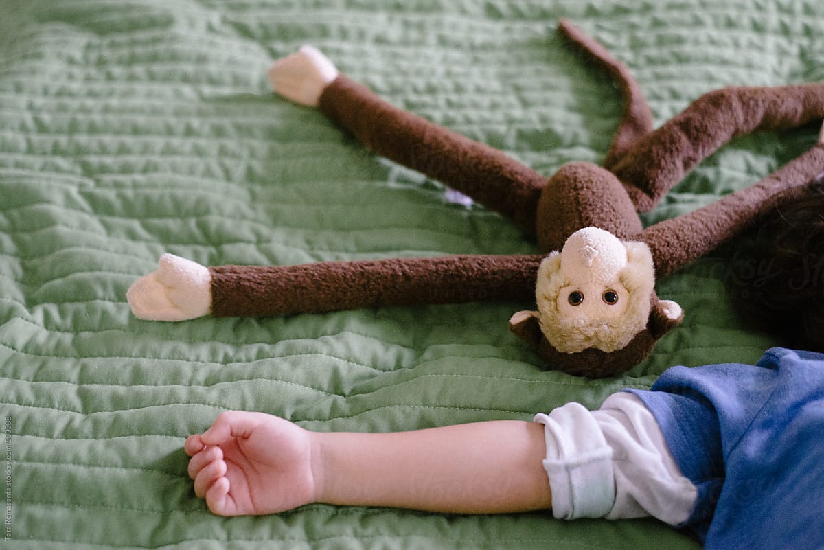 "Stuffed Animal Monkey Outstretched The Same As Sleeping Child" by ...