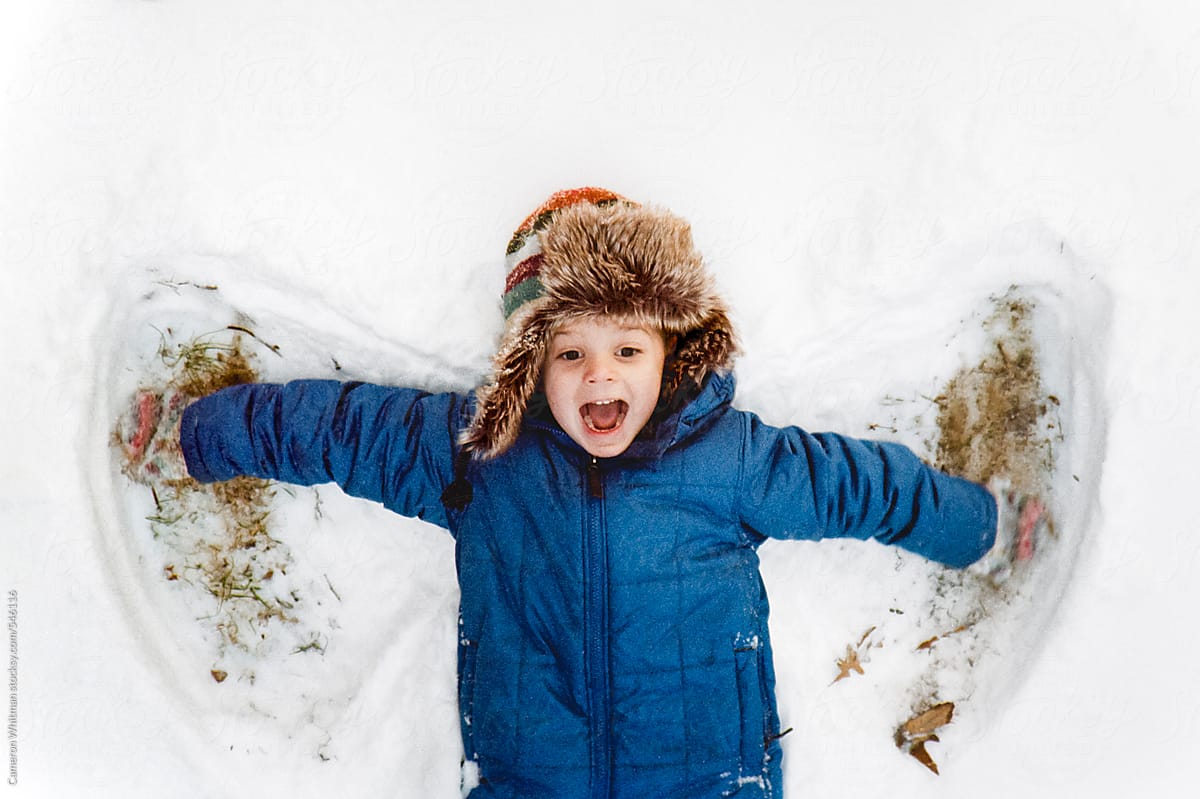 "Making Snow Angels" by Stocksy Contributor "CWP, LLC" - Stocksy