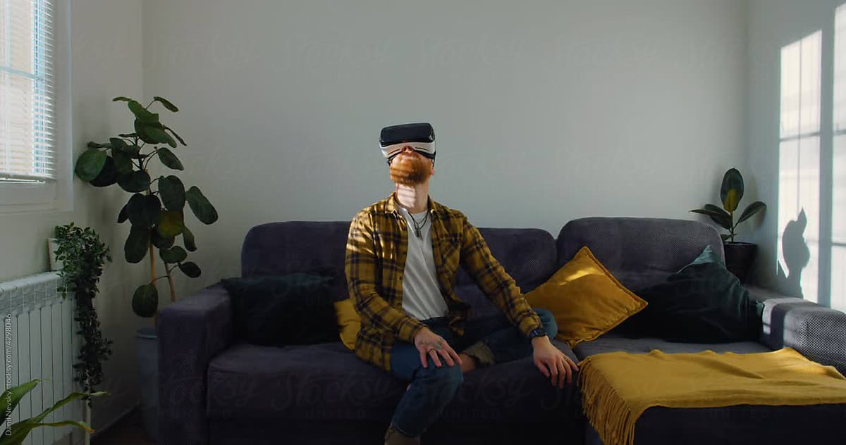 "Male Exploring Virtual Reality On Sofa" by Stocksy Contributor "Danil ...