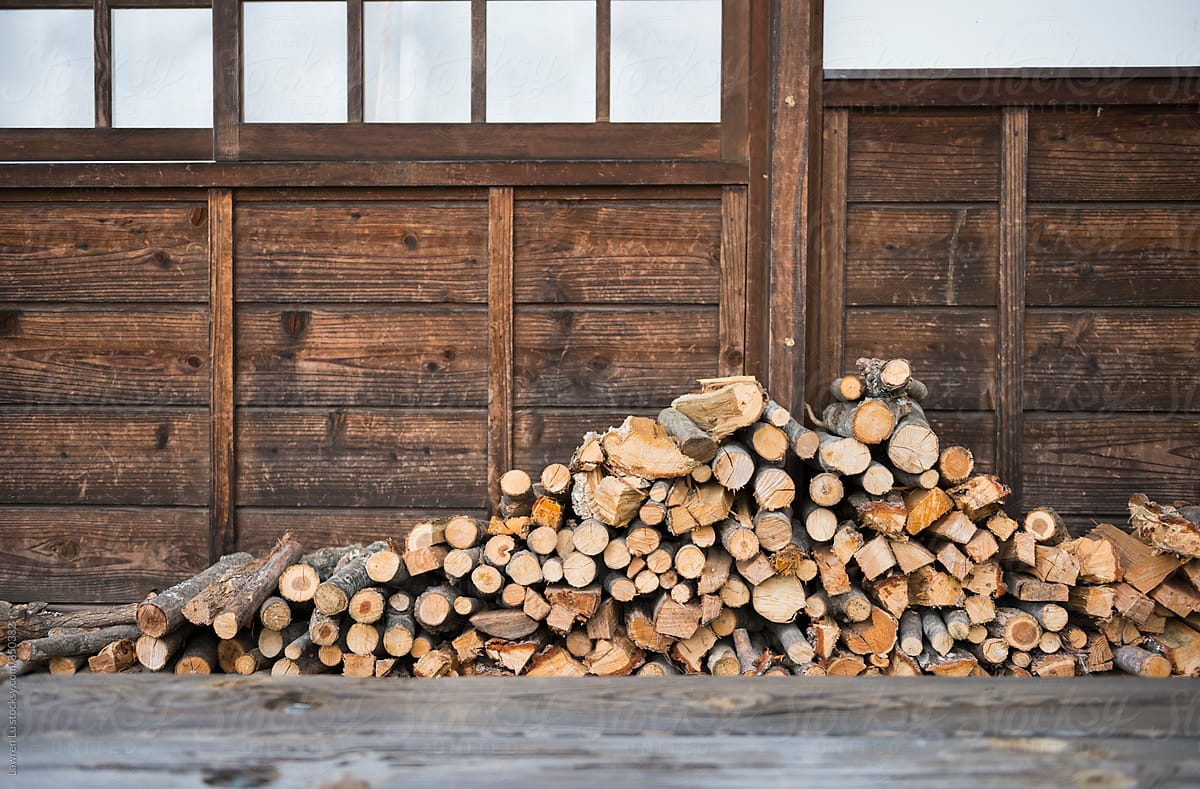 "The Chopped Wood Sitting In Front Of A Wooden Building." by Stocksy ...