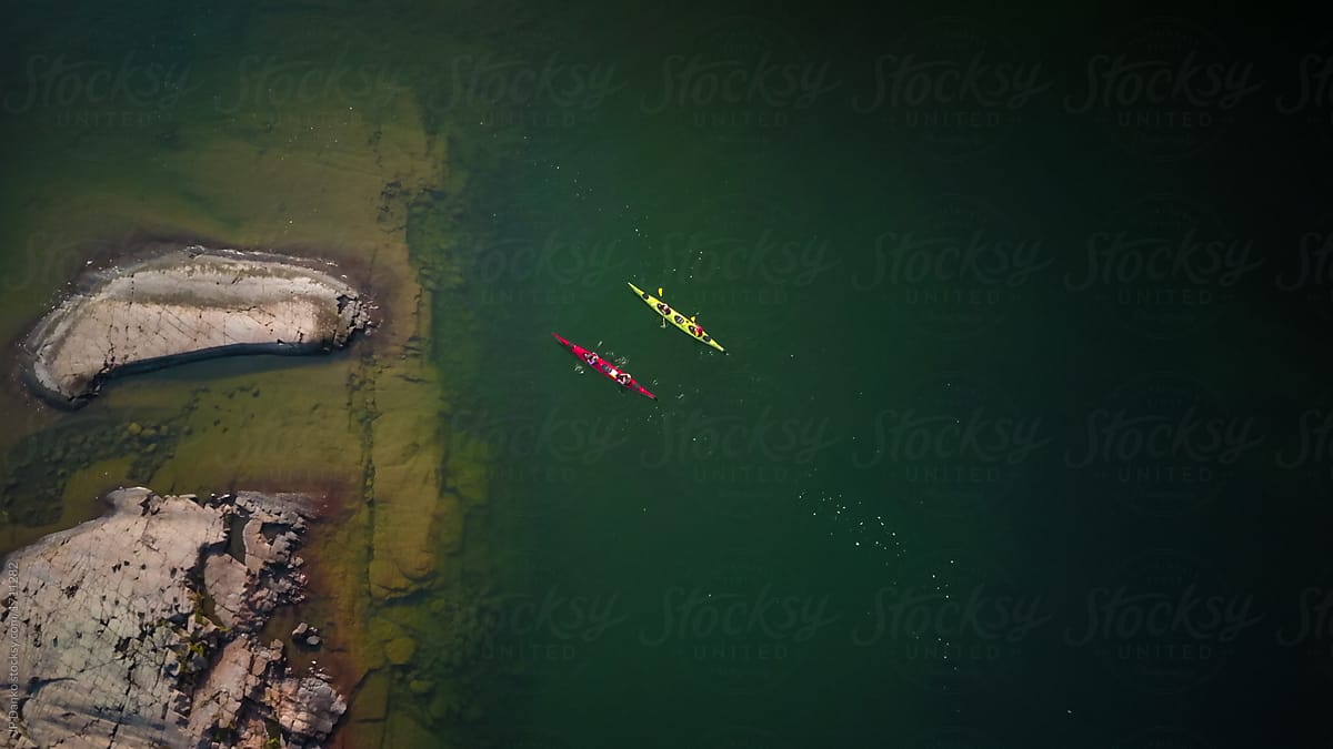 "Aerial Photo Of Paddlers Travelling By Sea Kayaks On Camping Trip To ...