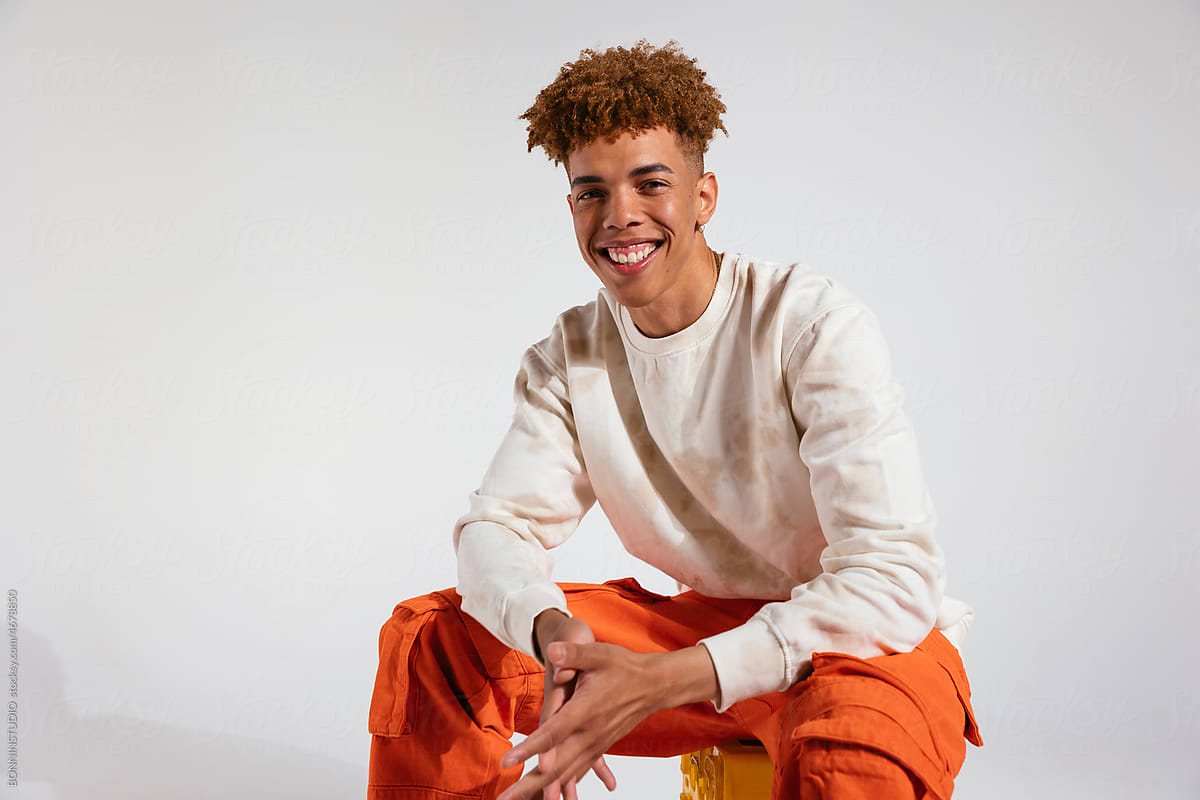 "Trendy Male Model Smiling In White Studio" by Stocksy Contributor ...