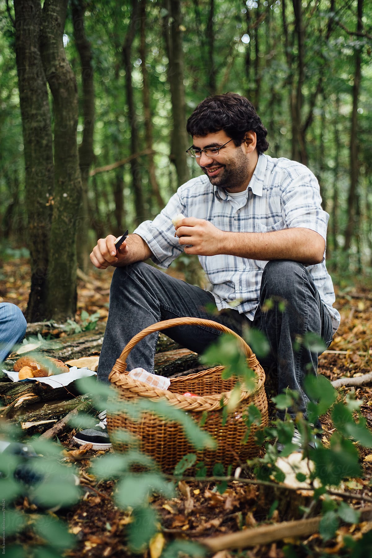 "Man Preparing A Snack In The Woods" by Stocksy Contributor "Boris ...