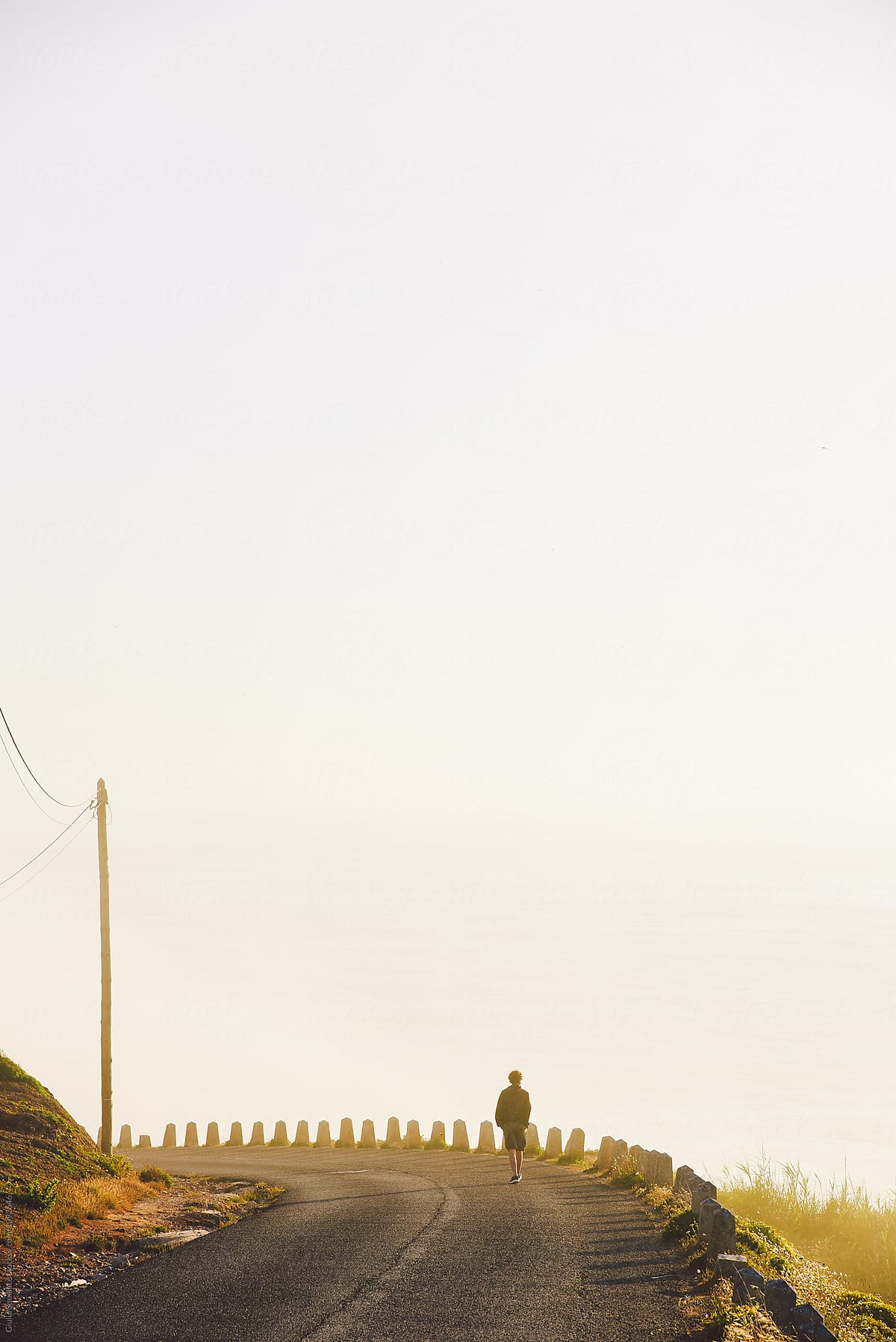 "Young Man Walking Solo In The Sunlight" by Stocksy Contributor "Giulia ...