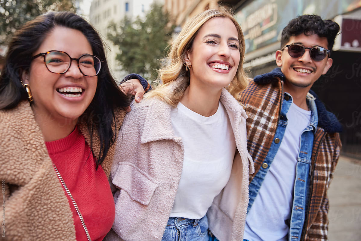"Happy Laughing Friends Walking In City Center" by Stocksy Contributor ...