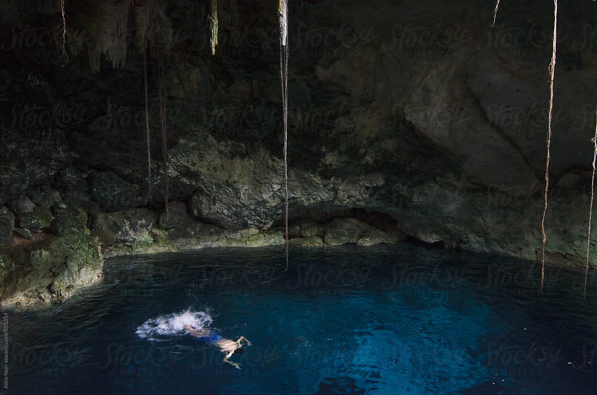 "Freediving In A Cenote Cave" by Stocksy Contributor "Alice Nerr" - Stocksy
