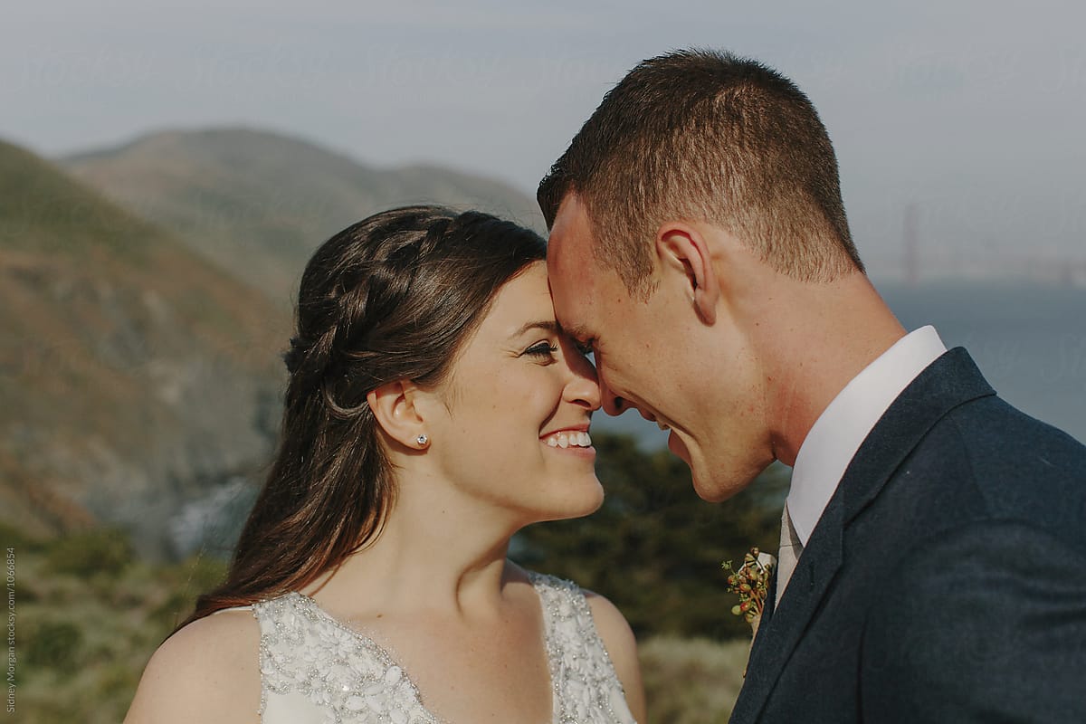 "Bride Laughing At Groom" by Stocksy Contributor "Sidney Scheinberg ...