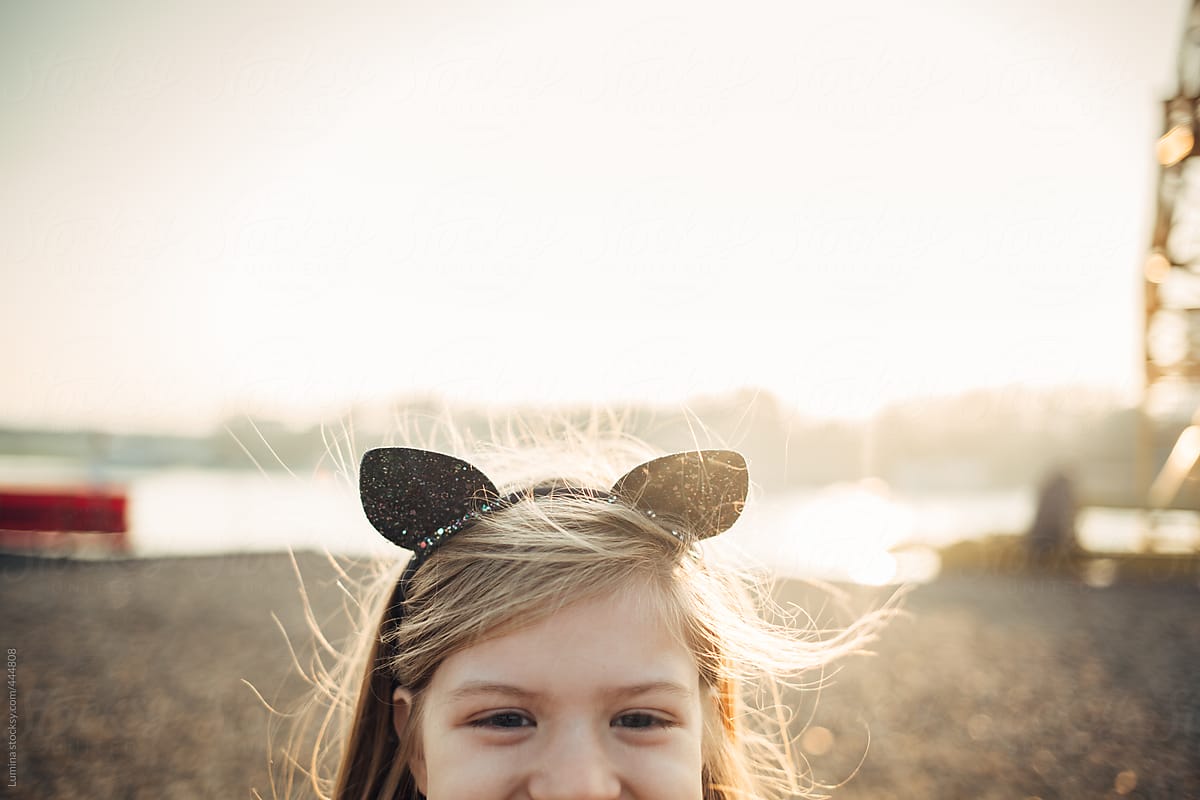 "Cute Girl With A Cat Ears Headband" by Stocksy Contributor "Lumina ...