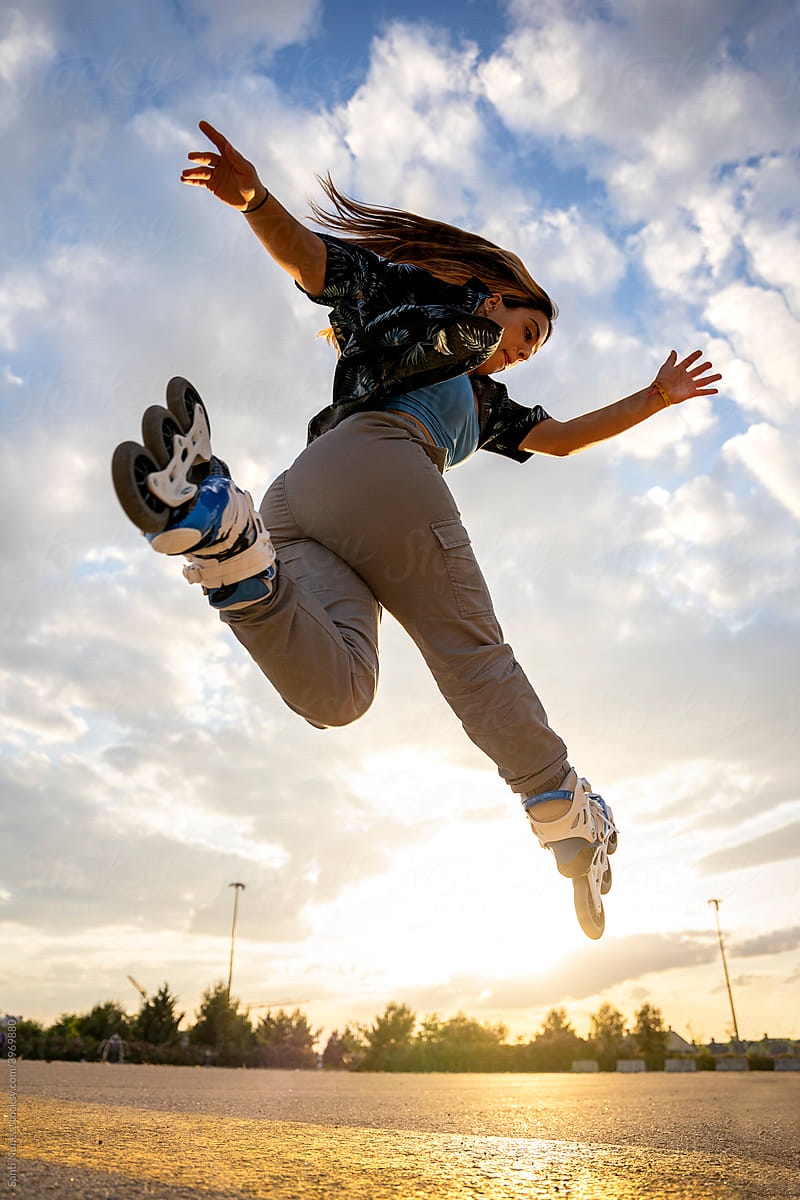 "Woman Rollerblading Alone" by Stocksy Contributor "Santi Nuñez" - Stocksy