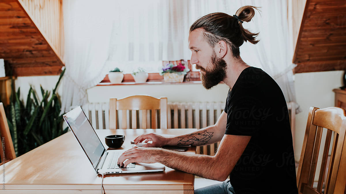 "Young Man Working At Home" by Stocksy Contributor "Boris Jovanovic ...