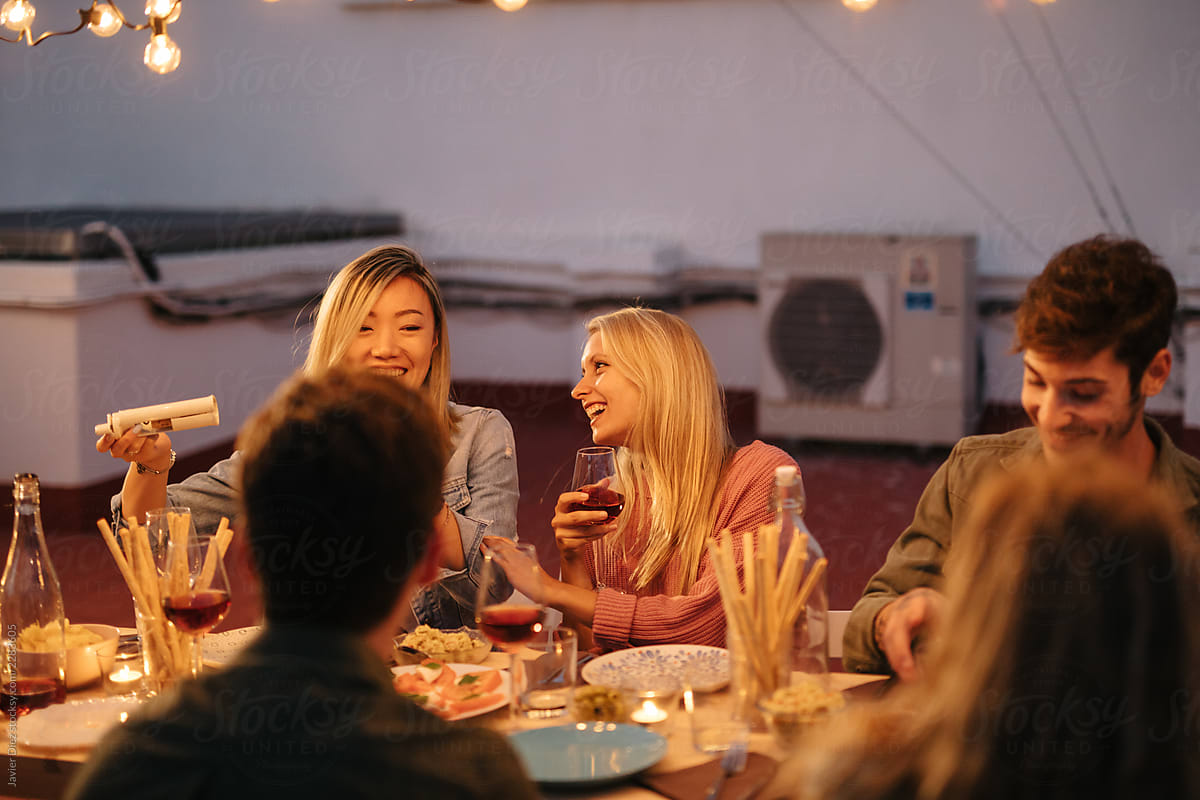 "Young People Having Fun At Party Table" by Stocksy Contributor "Javier ...